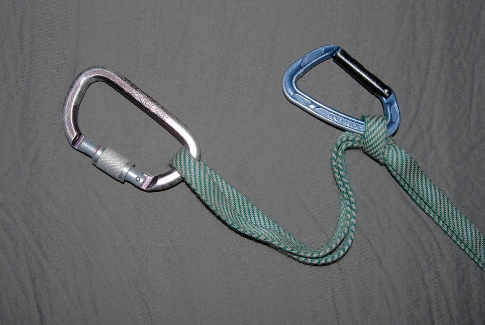Threading a carabiner through the knot on a sling used as PAS