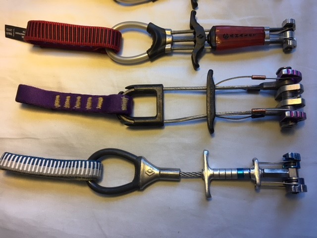 Black diamond C3 cams, x4 offset cam, purple cam, and friction belay device