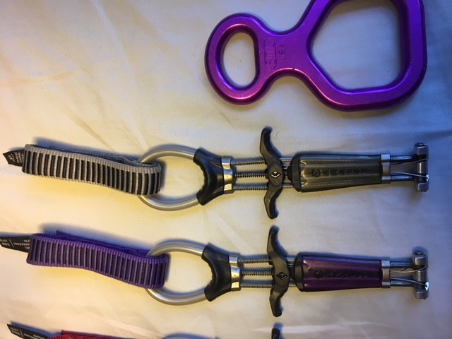 Black diamond C3 cams, x4 offset cam, purple cam, and friction belay device
