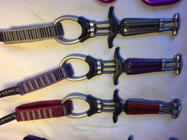 Black diamond C3 cams, x4 offset cam, purple cam, and friction belay device