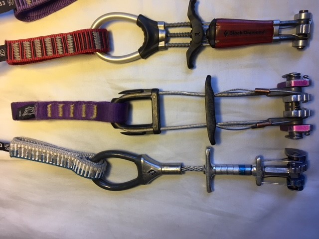 Black diamond C3 cams, x4 offset cam, purple cam, and friction belay device