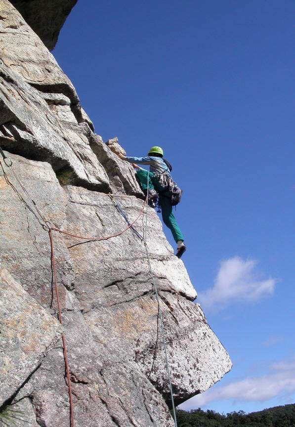 Jean Aschenbrenner climbing the airy arete on the second pitch of Layback.