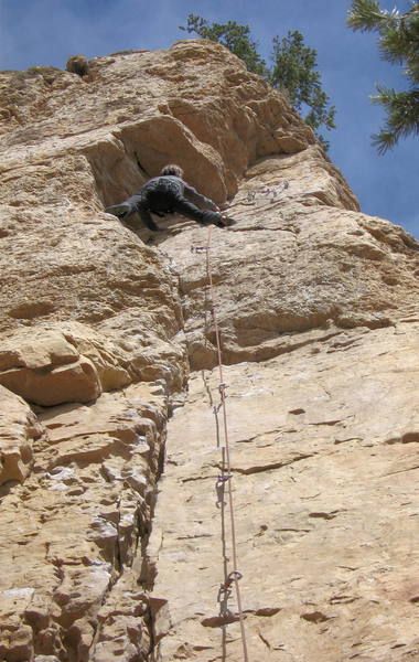 Peter Dillon at the roof, starting the traverse to the anchor.