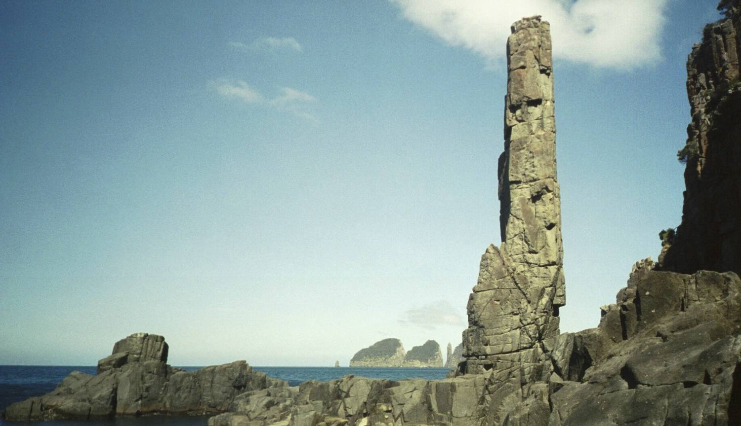 The Moai with Cape Hauy in the distance across Fortescue Bay. The ...
