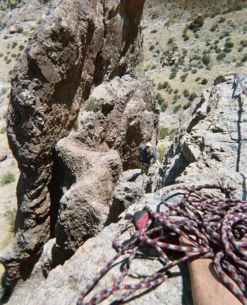Jimmy Purcell looking up halfway up the second pitch while I belay from ...