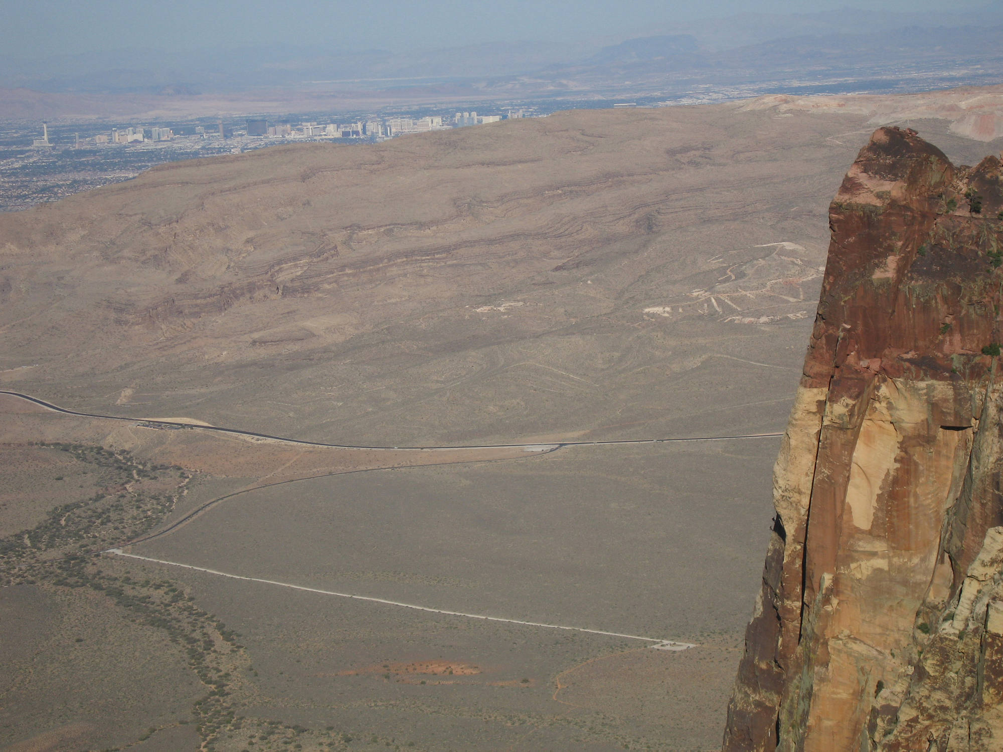 Climbers on Crimson Chrysalis with Las Vegas Strip and Lake Mead in the ...