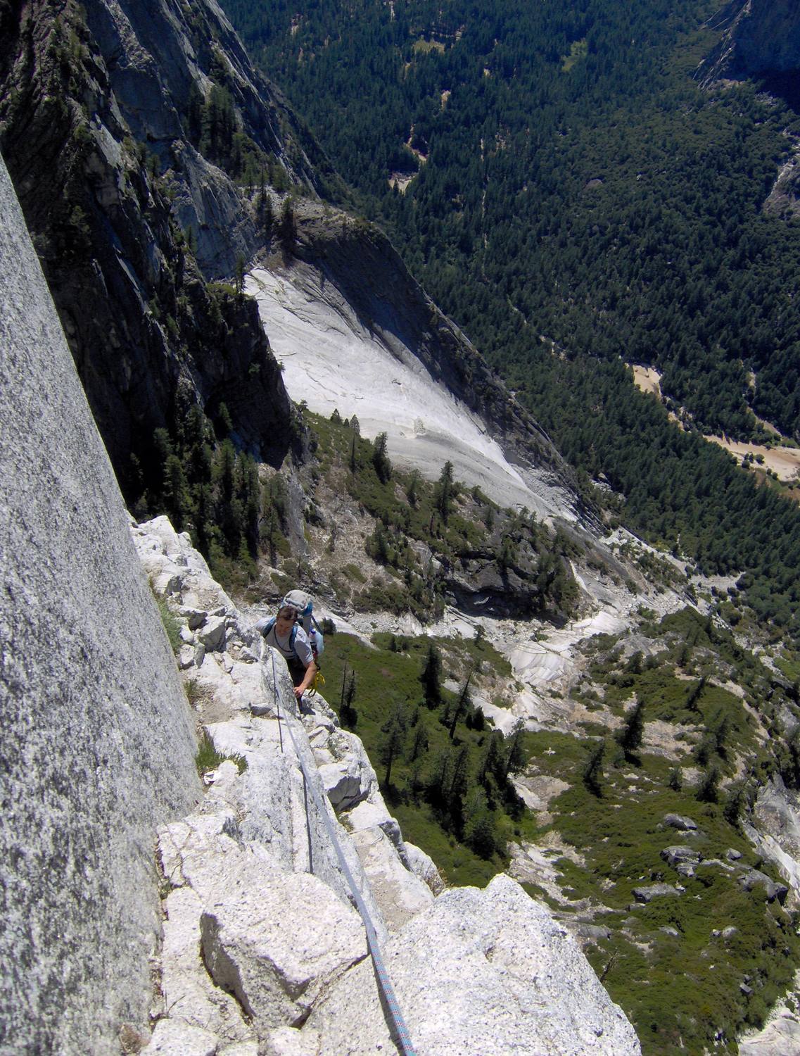 Steve Cox scrambling up the 4th class choss on pitch 9. Careful not to ...