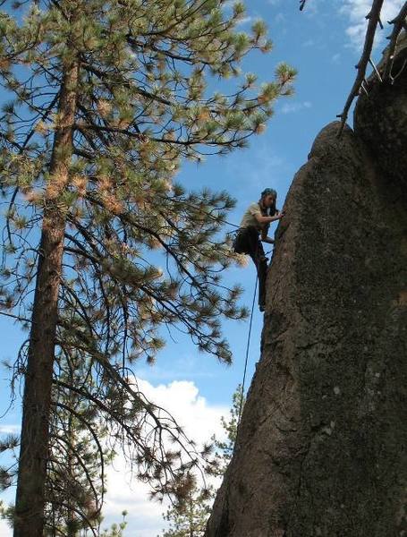 Elaine passing the last bolt of Powder Keg (5.10a), Holcomb Valley ...