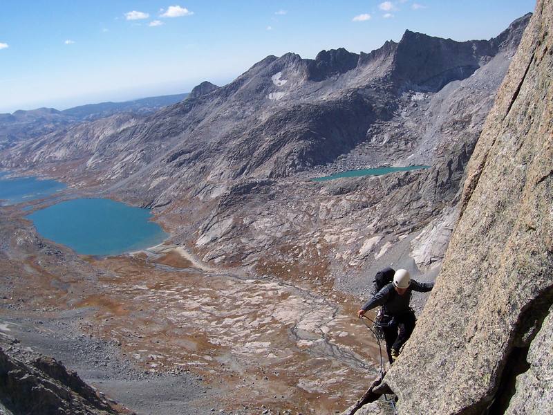 An exposed traverse on the Tower Ridge, looking down into Titcomb Basin ...