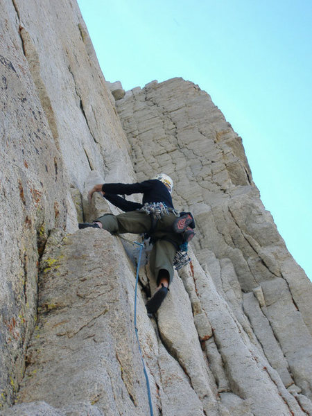 Climbing on the Red Dihedral. The namesake dihedral looms above.