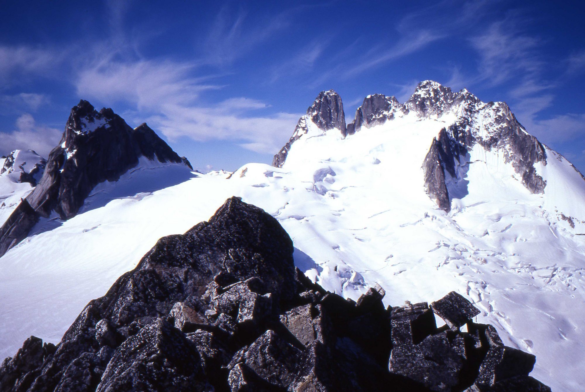 Pigeon Spire and the Howsers as seen from near the summit of Bugaboo Spire.