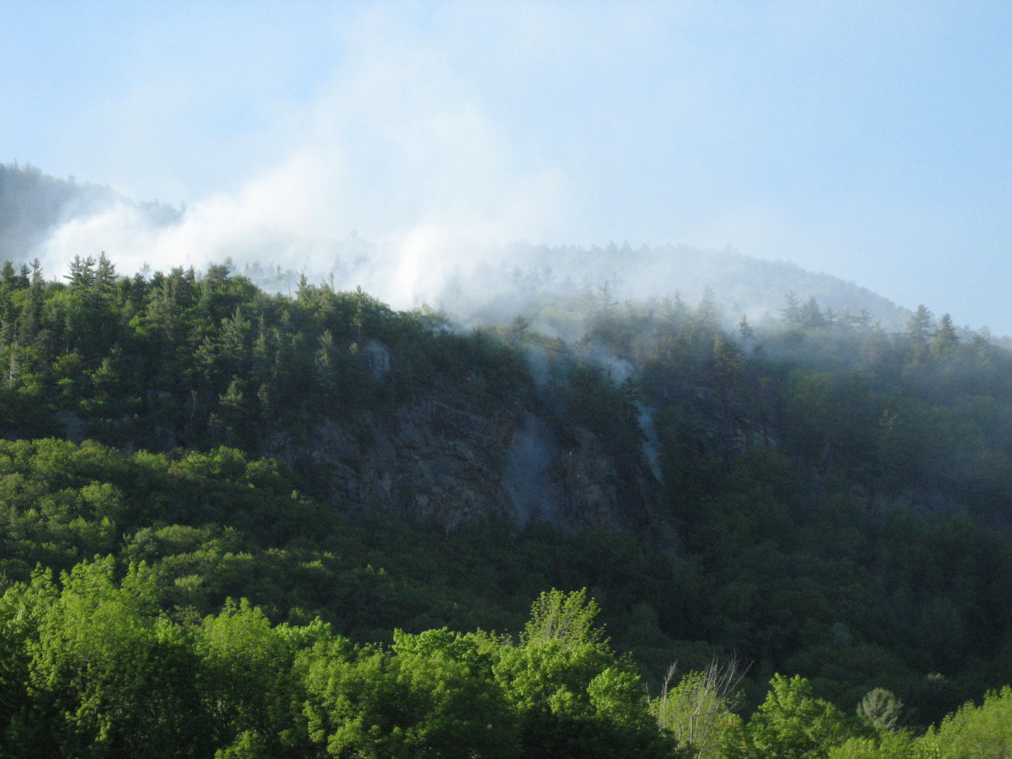 Rumney forest fire, May 28th. This is a view of Main Cliff from the road.