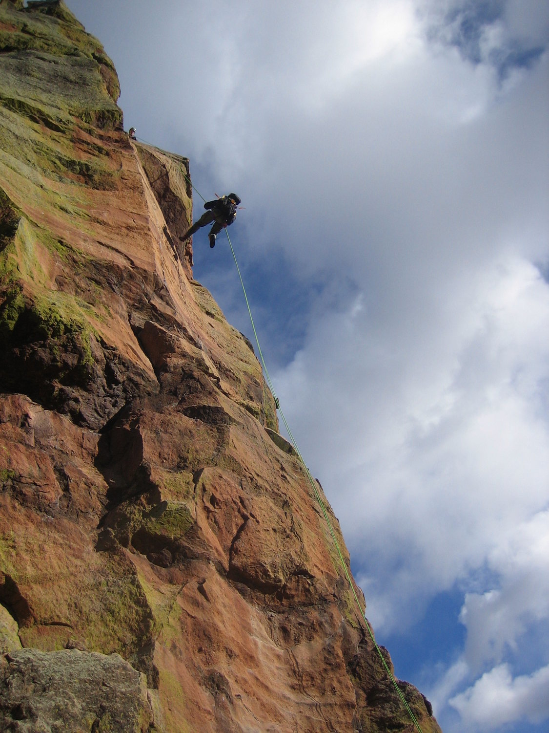 Mark Knutson rappelling off the backside of the third.