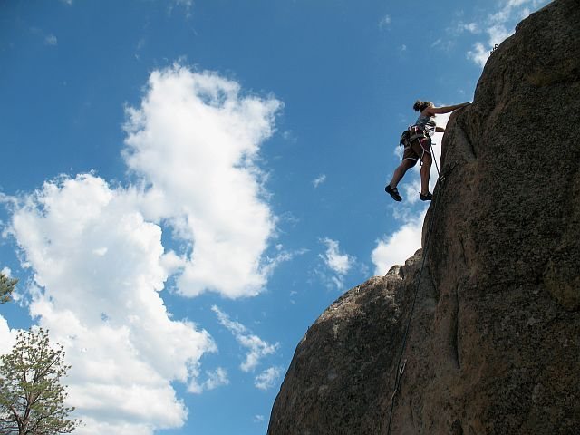Susan at the anchors on Real Men of Genius (5.10b), Holcomb Valley ...