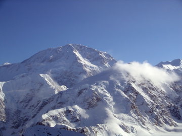 Denali as seen from Mt Hunter. The sun/shade line in the center is the ...