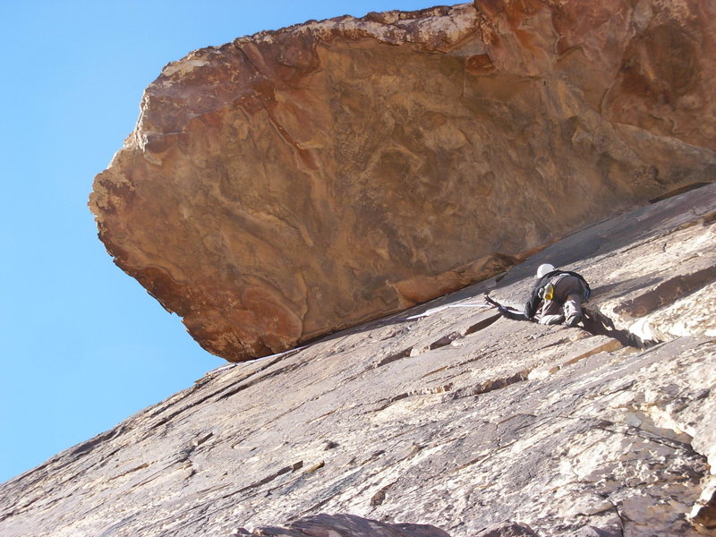George Rhee following the crux pitch below the roof.