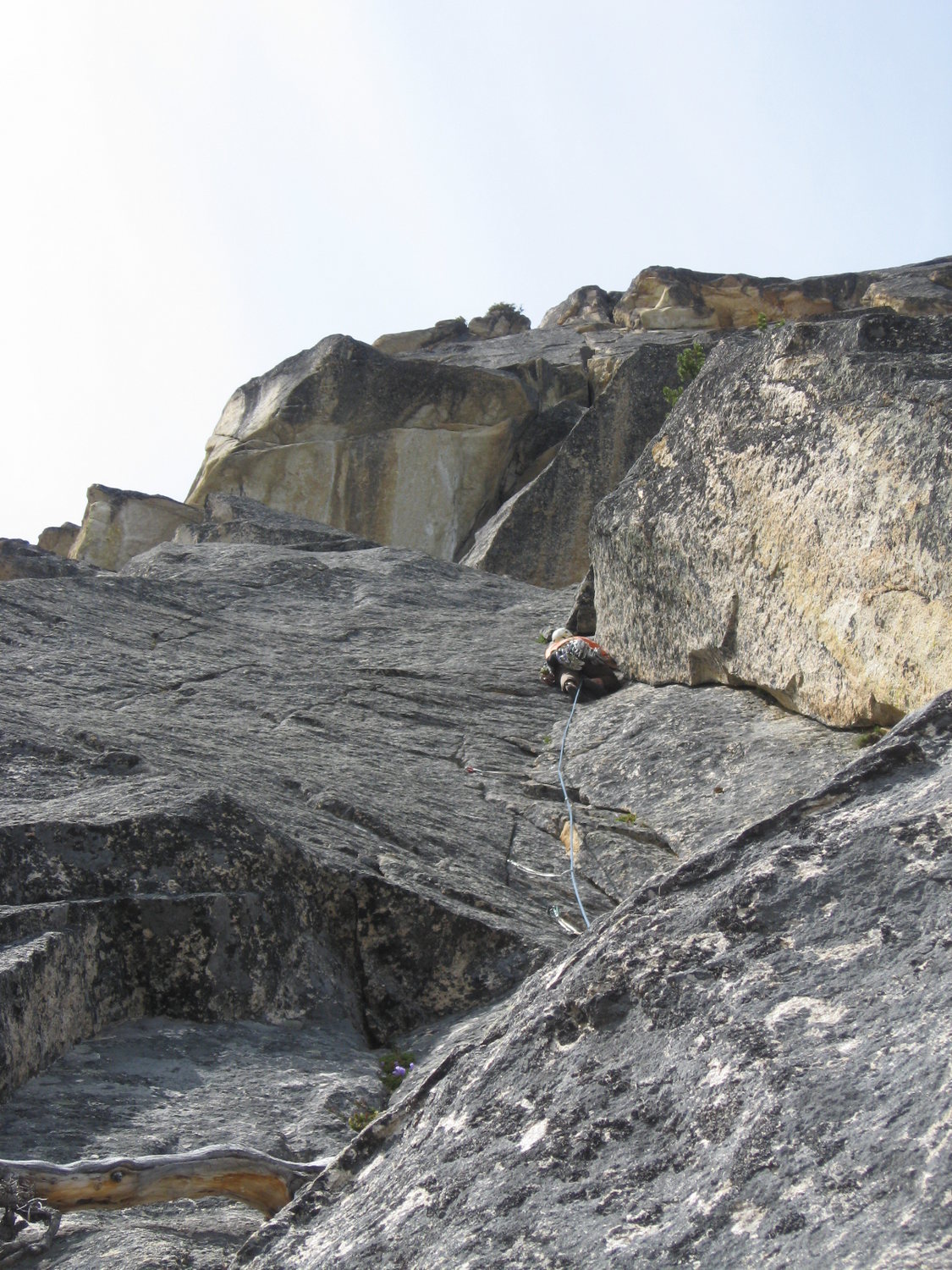 Climbing the left facing corner on pitch 3. The preferred start is to ...