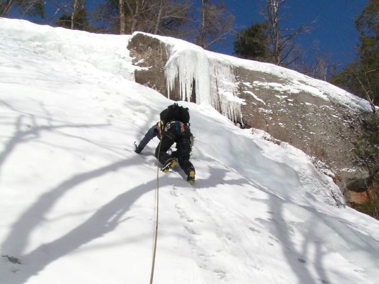 Maurice Corrigan sets out on P1 of the Waterfall on Crane Mtn's SE slope.