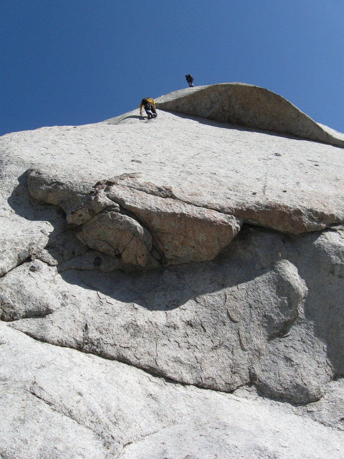 Perin belays Lee on P1. Lee is about to make the traverse left. 20100424.