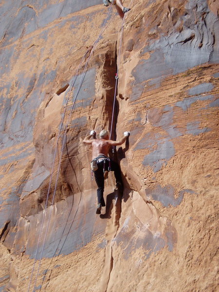Steve Arsenault beginning the upper crux. Brian Delaney belaying.