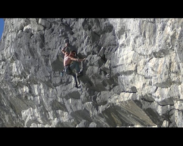 The crux move in the upper half of the route