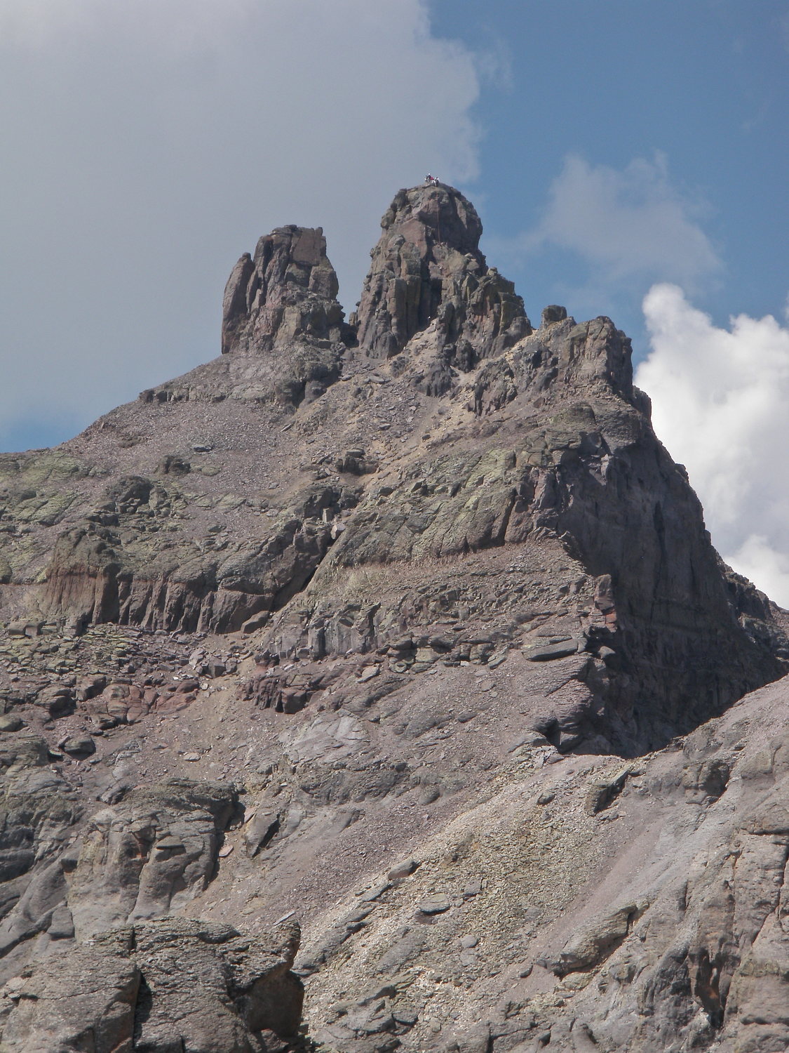 Dallas peak with climbers on its top as seen from the east.