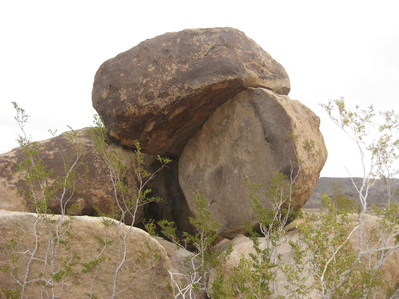 The obvious crack between the two circular rocks.