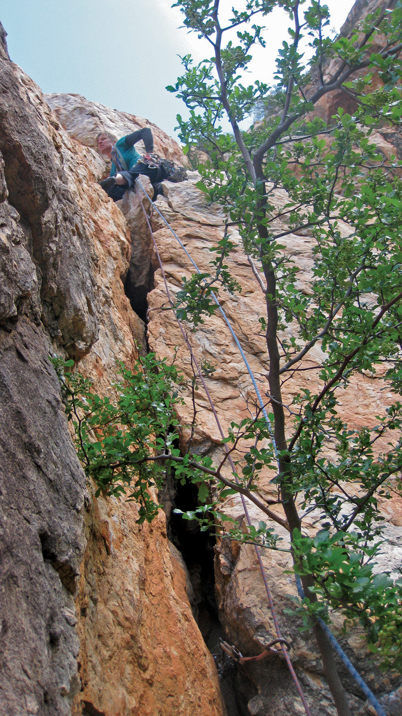 Emma Alsford on the third pitch of Firesword, on the first ascent 5.10b ...
