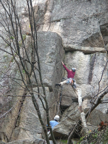 Unknown climber spread-eagled on the crux dihedral of Funhouse. Unknown climber spread-eagled on the crux dihedral of Funhouse.