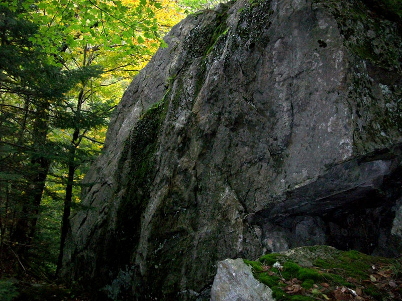 Climbing in Jam Crack Boulder, WM: Franconia Notch