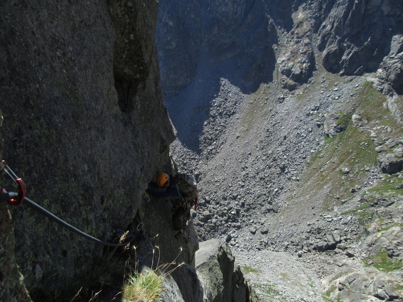 Ellie Thompson coming across on the exposed hand traverse. Pitch 6 of 9.