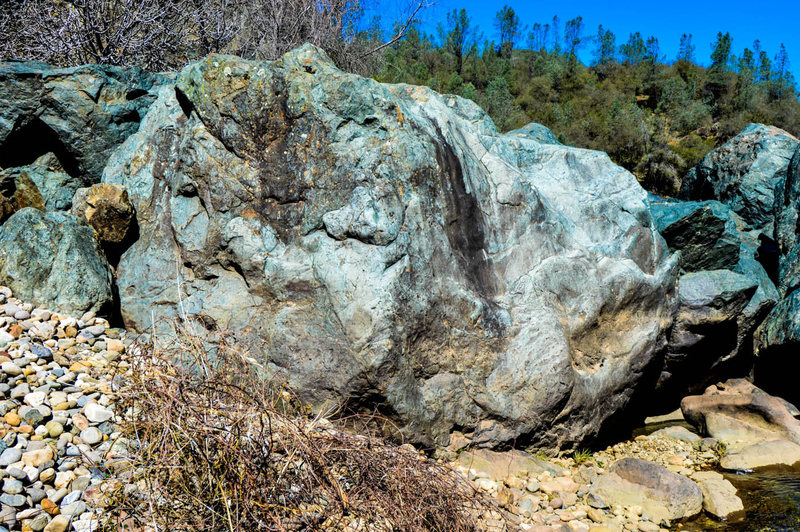 4 or more lines on this bright green limestone boulder set right by the ...