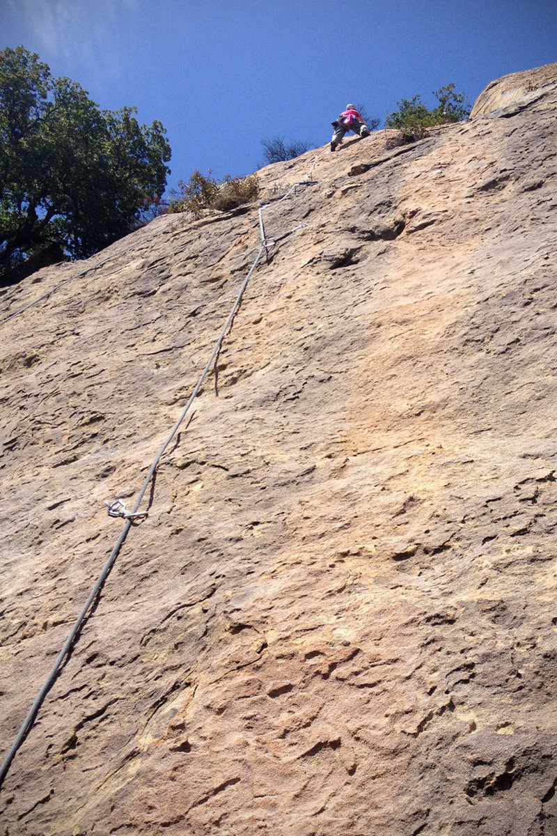 Patrick Callery climbs through the upper headwall of Tender Flakes of ...