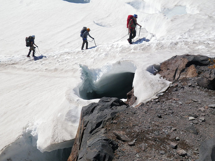 A party navigating a crevasse as they enter Camp Schurman
