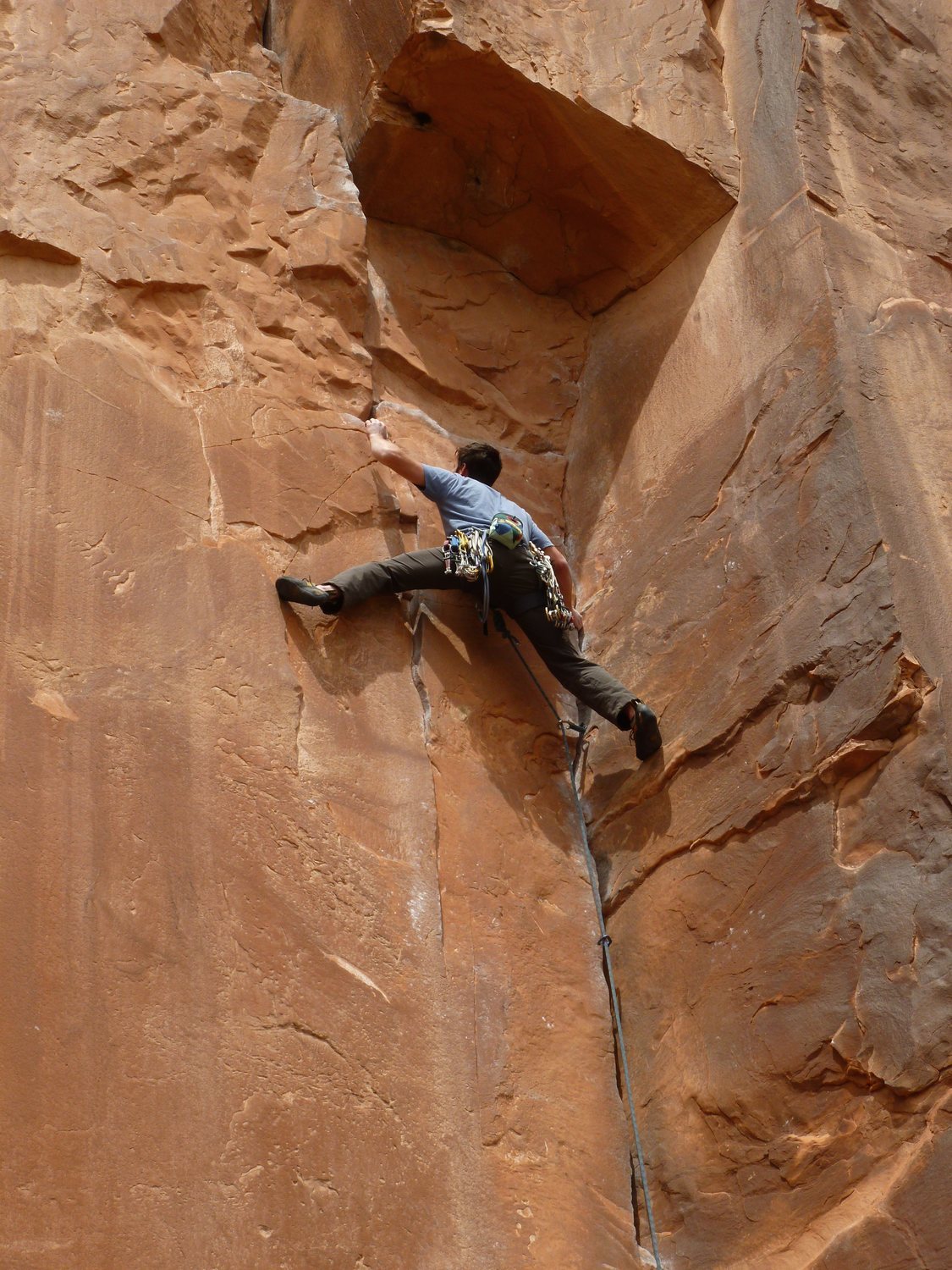 Matt below the roof, entering the crux of the climb