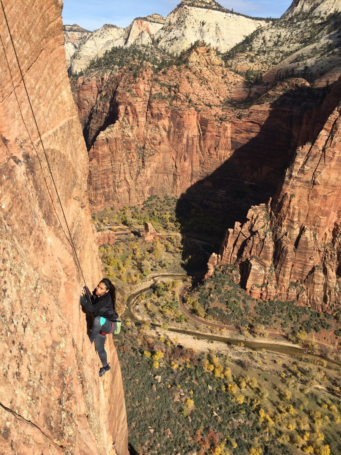 Lucy Brito reviewing prior lessons on Moonlight Buttress in Zion.