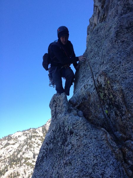 Traversing to the tree belay on the fourth pitch of The Long Climb.
