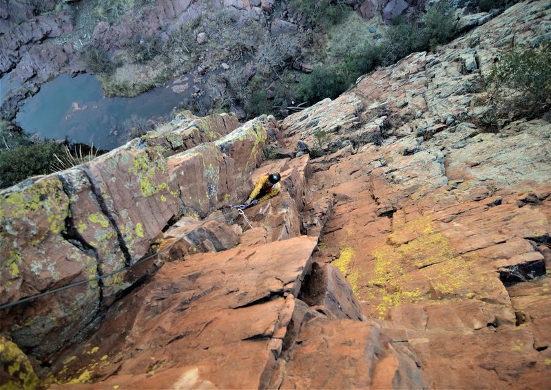 Gray Thompson climbing the second pitch of M&M Dihedral at the bottom ...