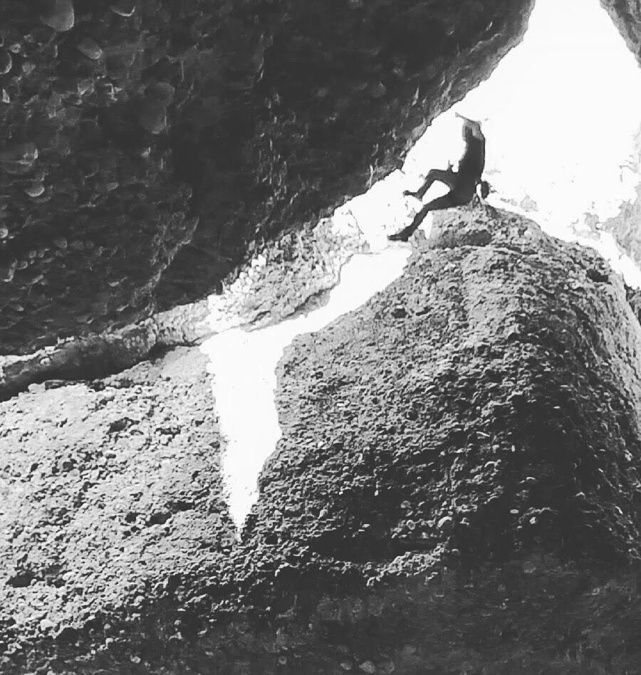 Nate Layton mid-fall on the crux of Loser.