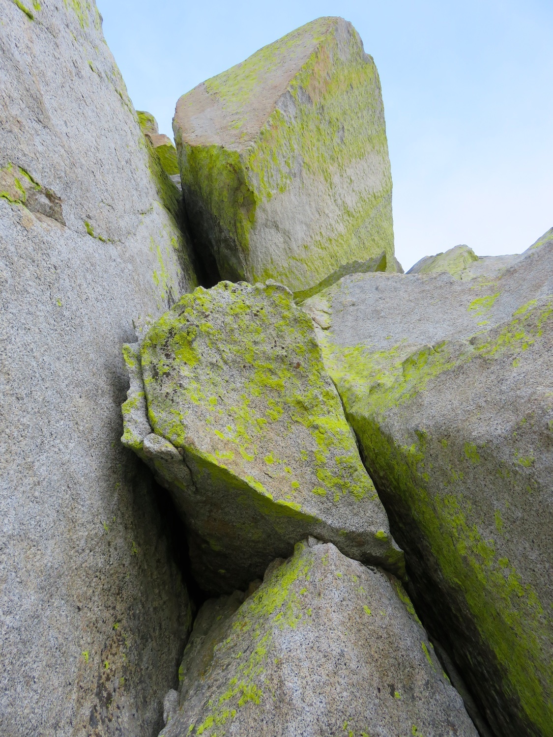 The final pitch continues up blocky terrain to the ledge that ...