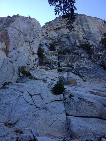 Looking up from the ground. Follow the right facing dihedral past a ...