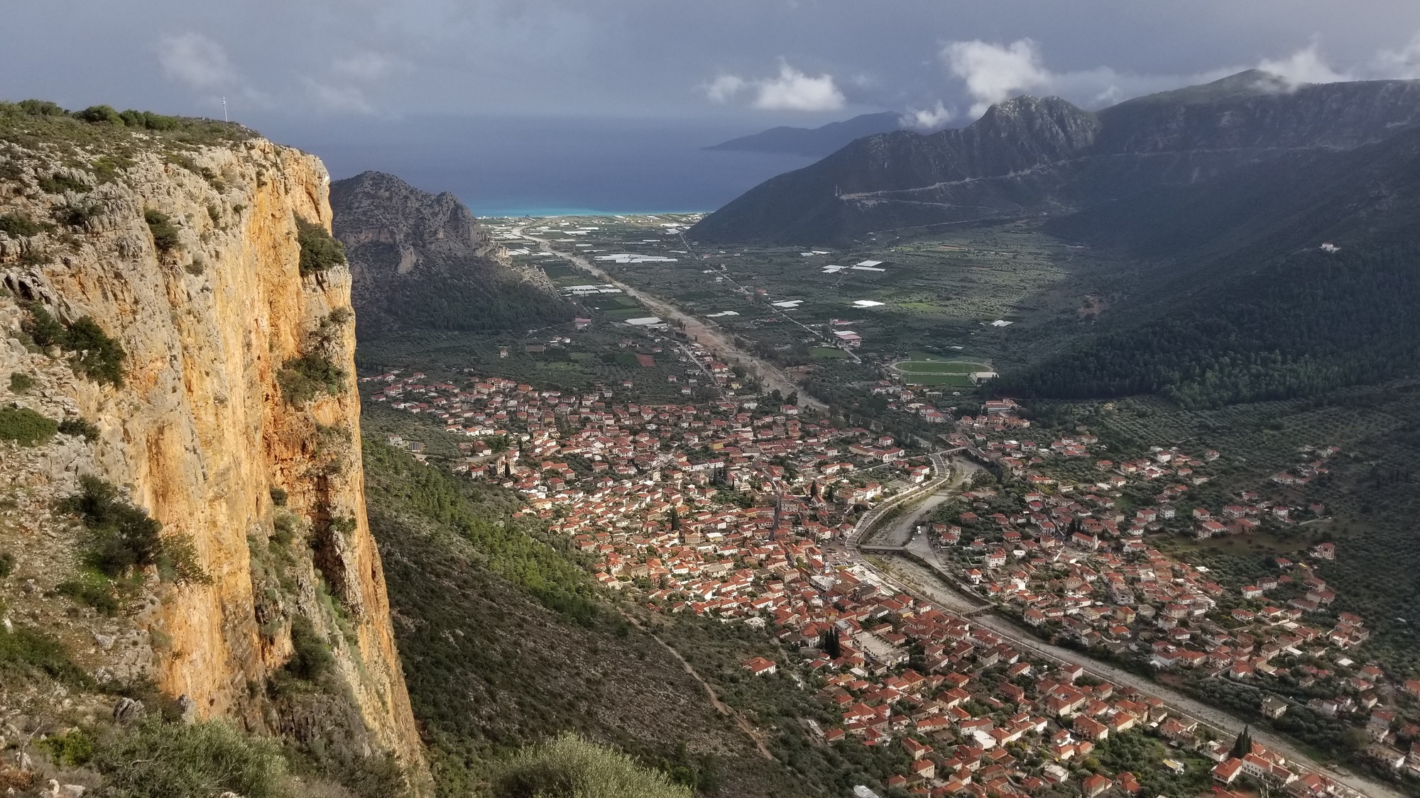 Looking down on the town of Leonidio and the Aegean Sea from the top of ...