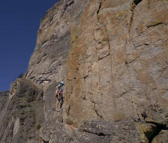 Starting up pitch 1 after short traverse move to gain arete. Photo ...