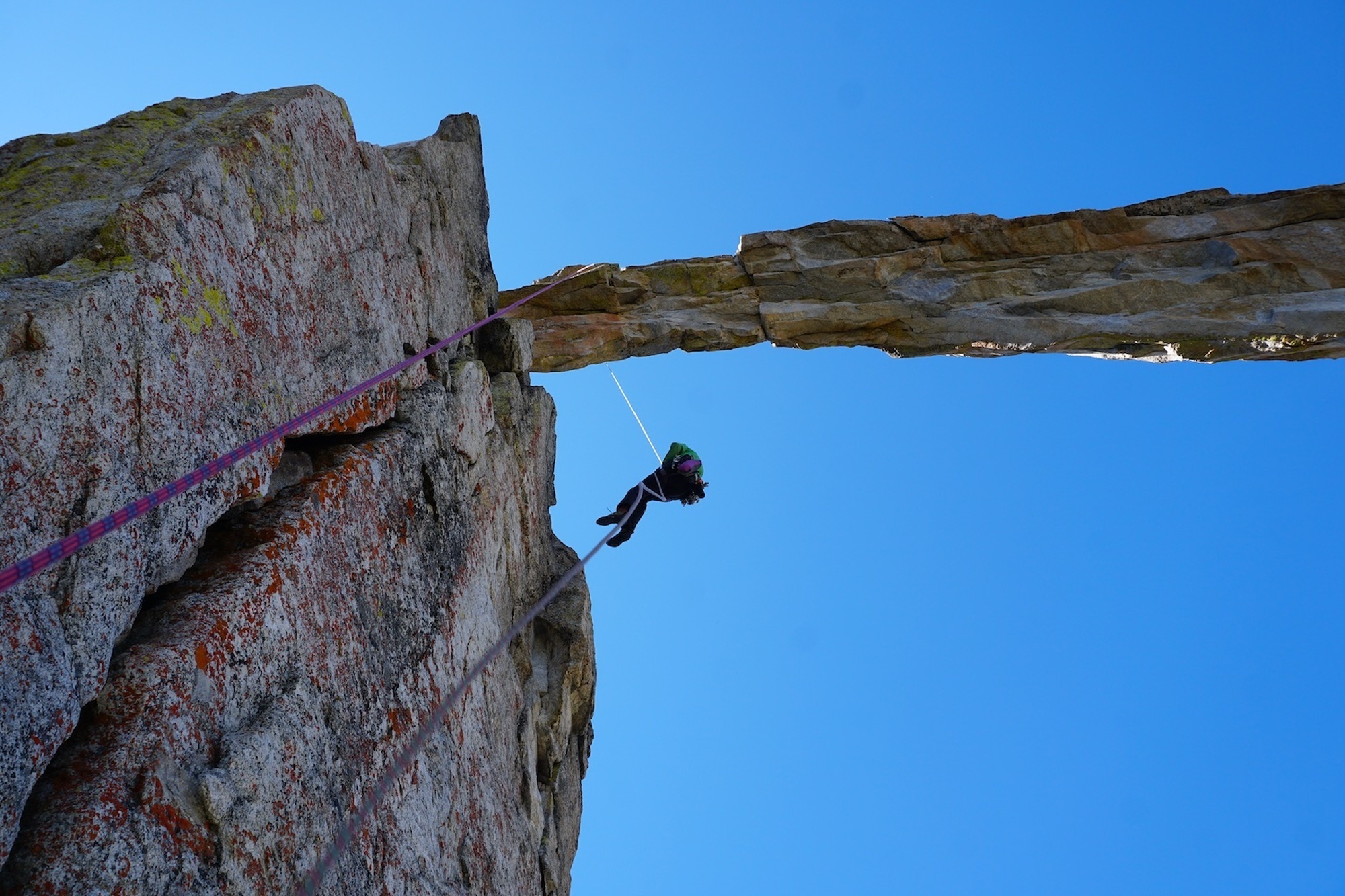 Counterbalance rappel. Both climbers rappelling at once, with the ...