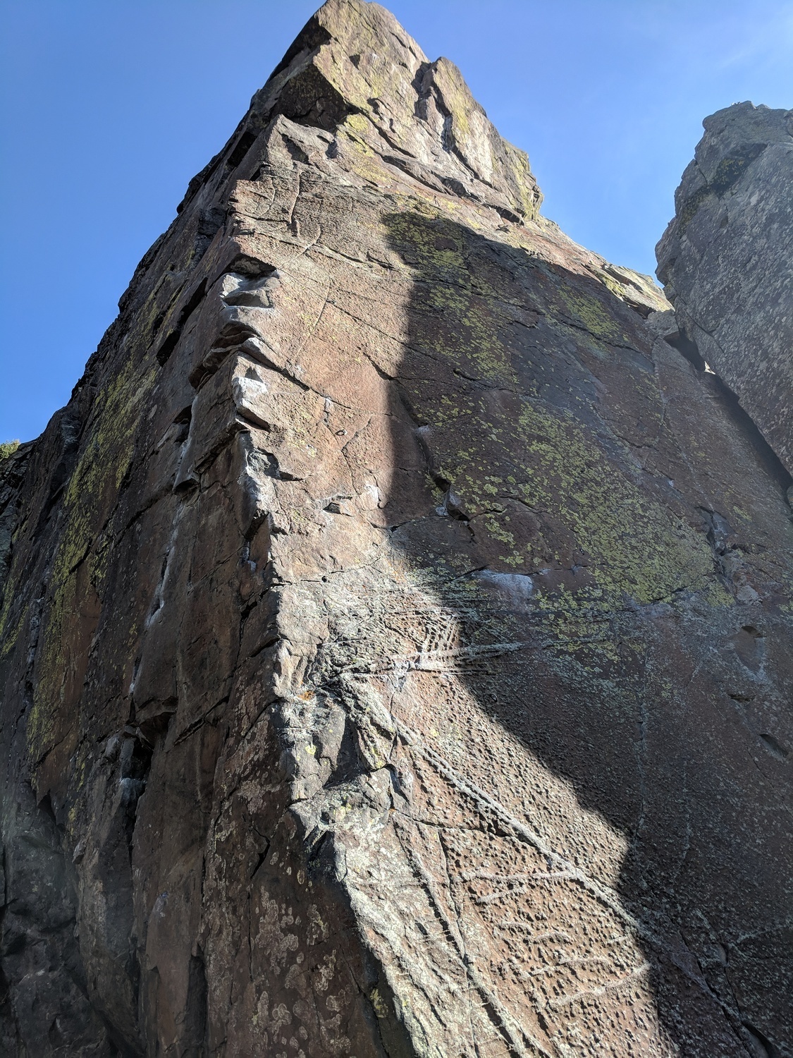 Climbs the right side of this striking arete