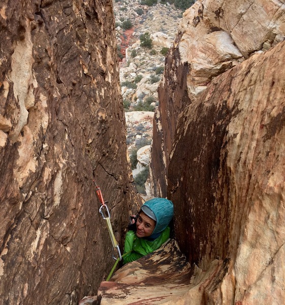 Giselle Field squeezes through the last squeeze of the route. Note the ...