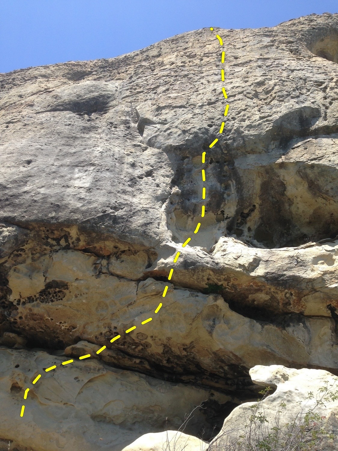 Route moves out of initial overhang and goes into cave its lower left ...