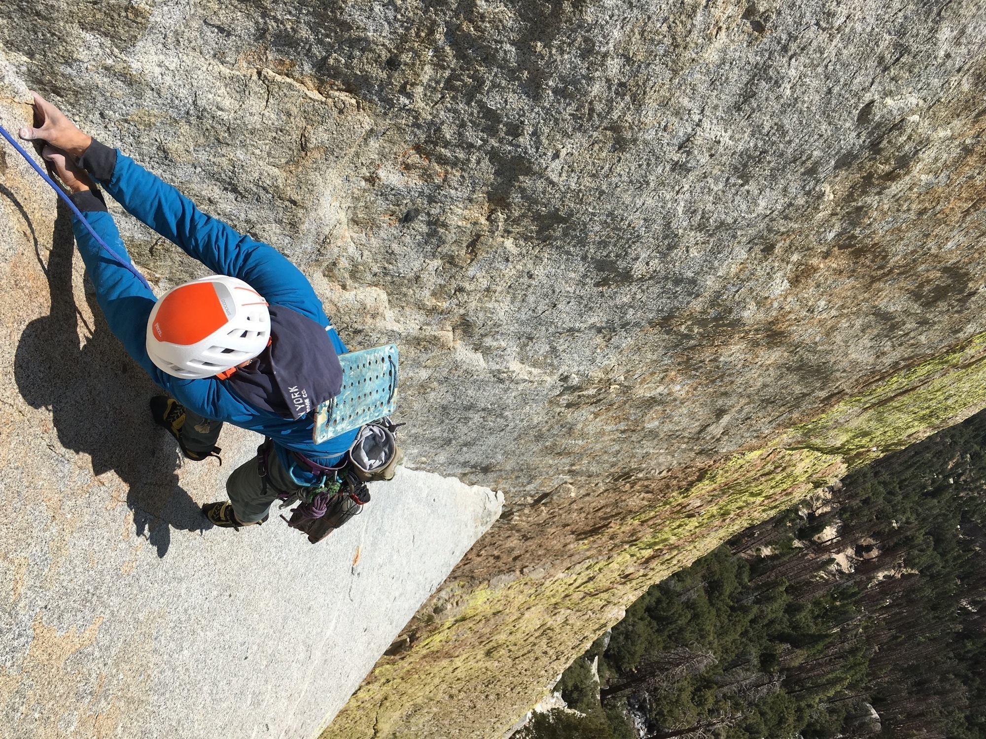 Fan carrying a skateboard belay seat for luxurious hanging belays.