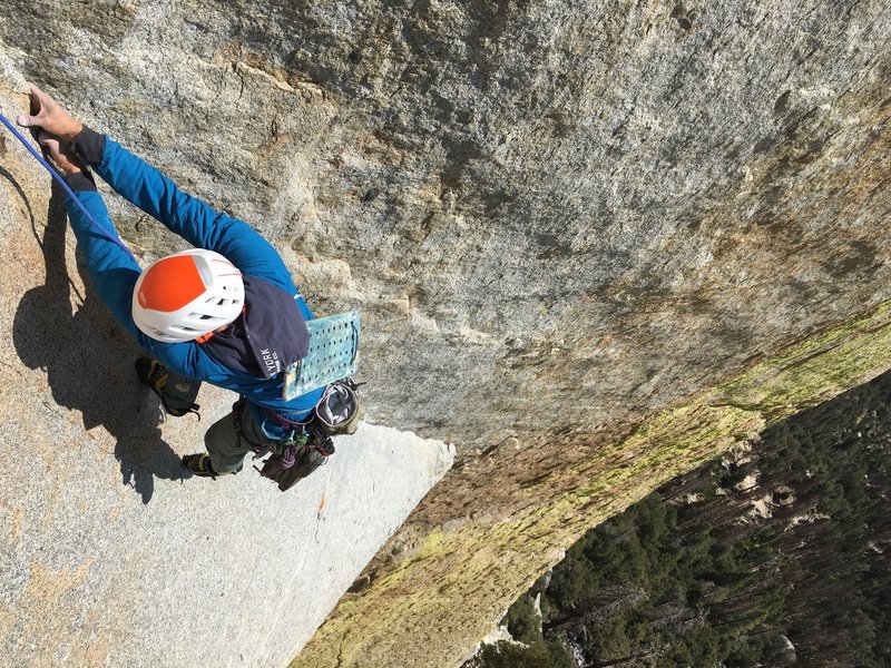 Fan carrying a skateboard belay seat for luxurious hanging belays.