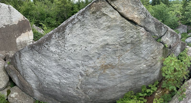 This pyramid shaped boulder is about 20 ft tall in the center. It has ...